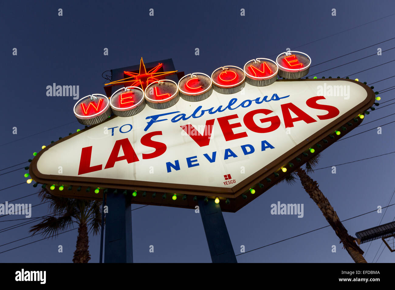 Famous neon Welcome to Fabulous Las Vegas sign surrounded by palm trees ...