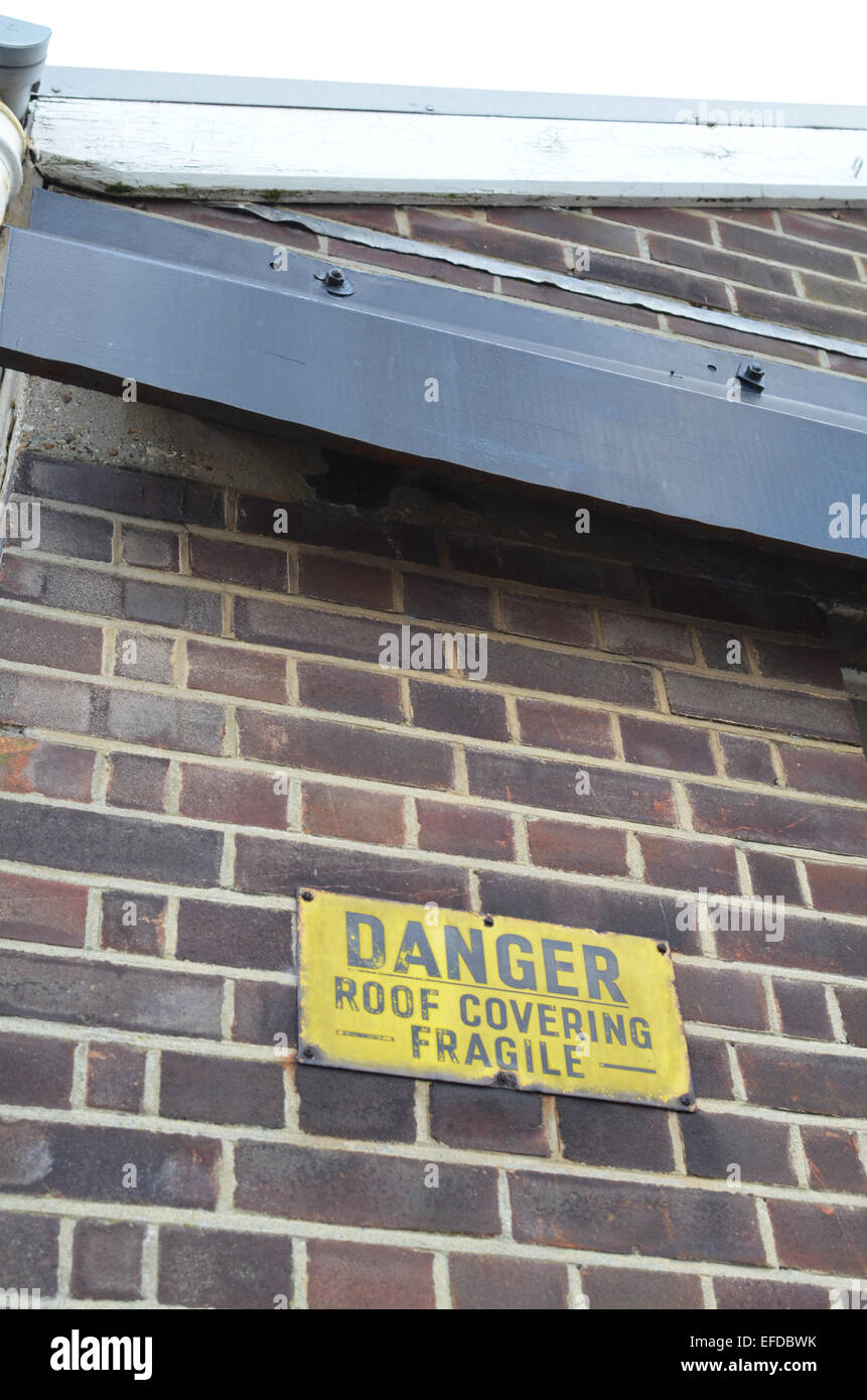 Danger fragile roof covering sign Stock Photo - Alamy