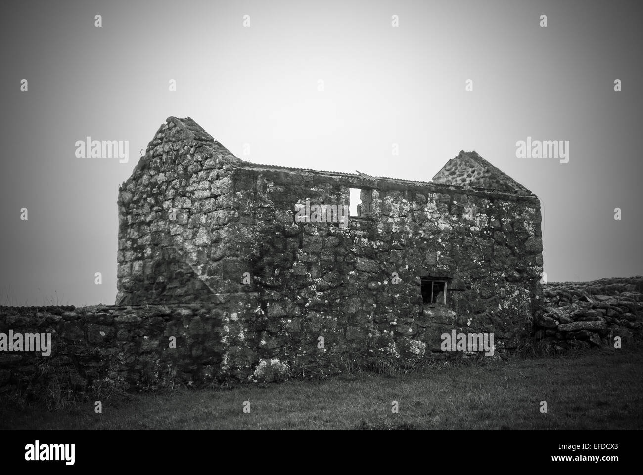 Old Cornish barn on the way down to Lands End, edited in to black and ...