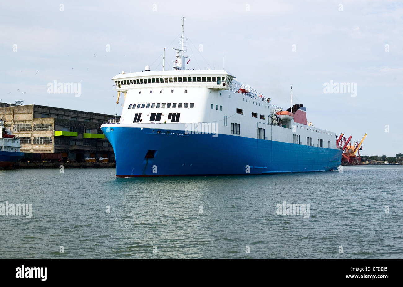 Large commercial freighter in a harbor, transport concept Stock Photo ...