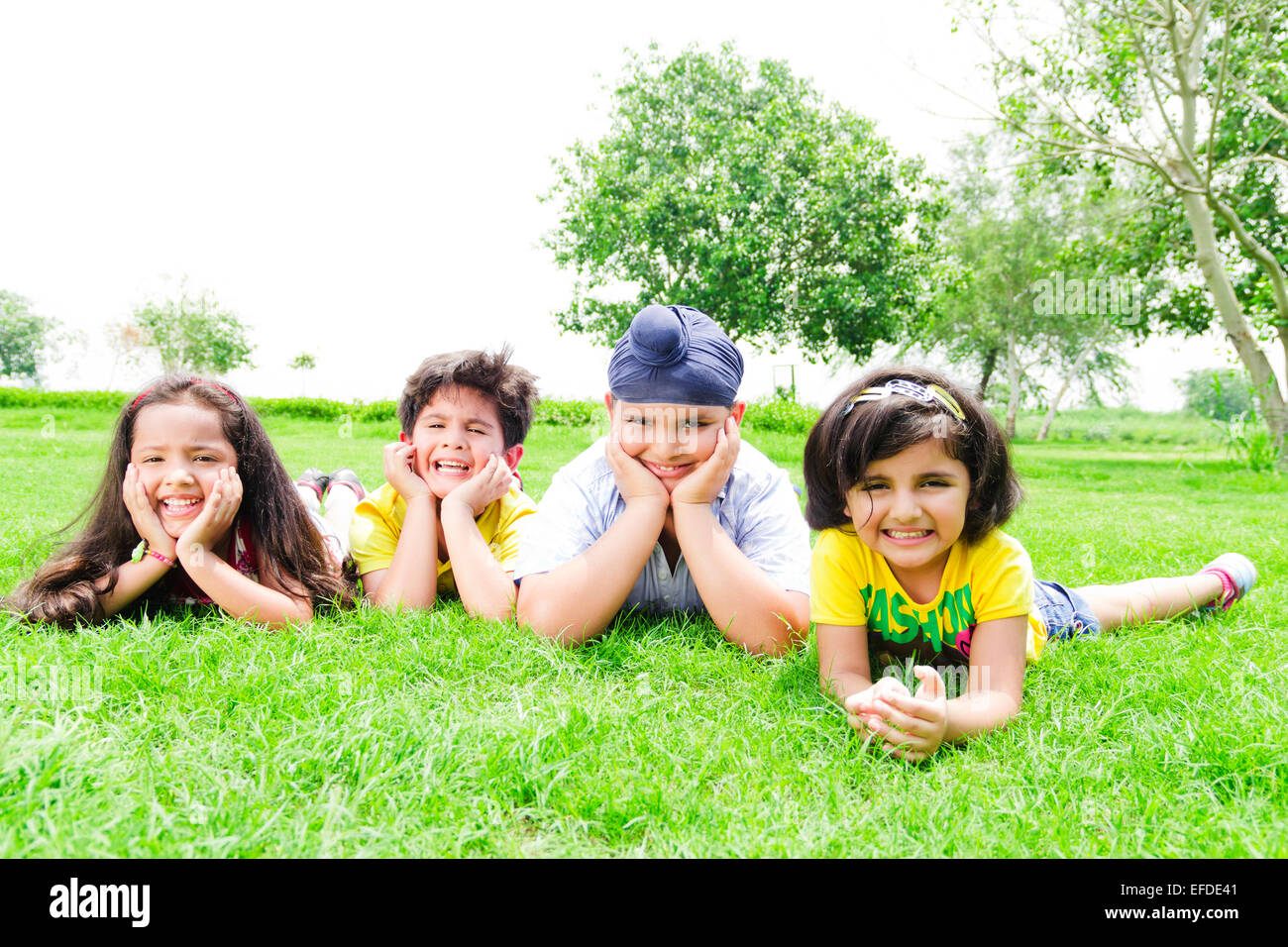 4 indian children friends park enjoy Stock Photo - Alamy