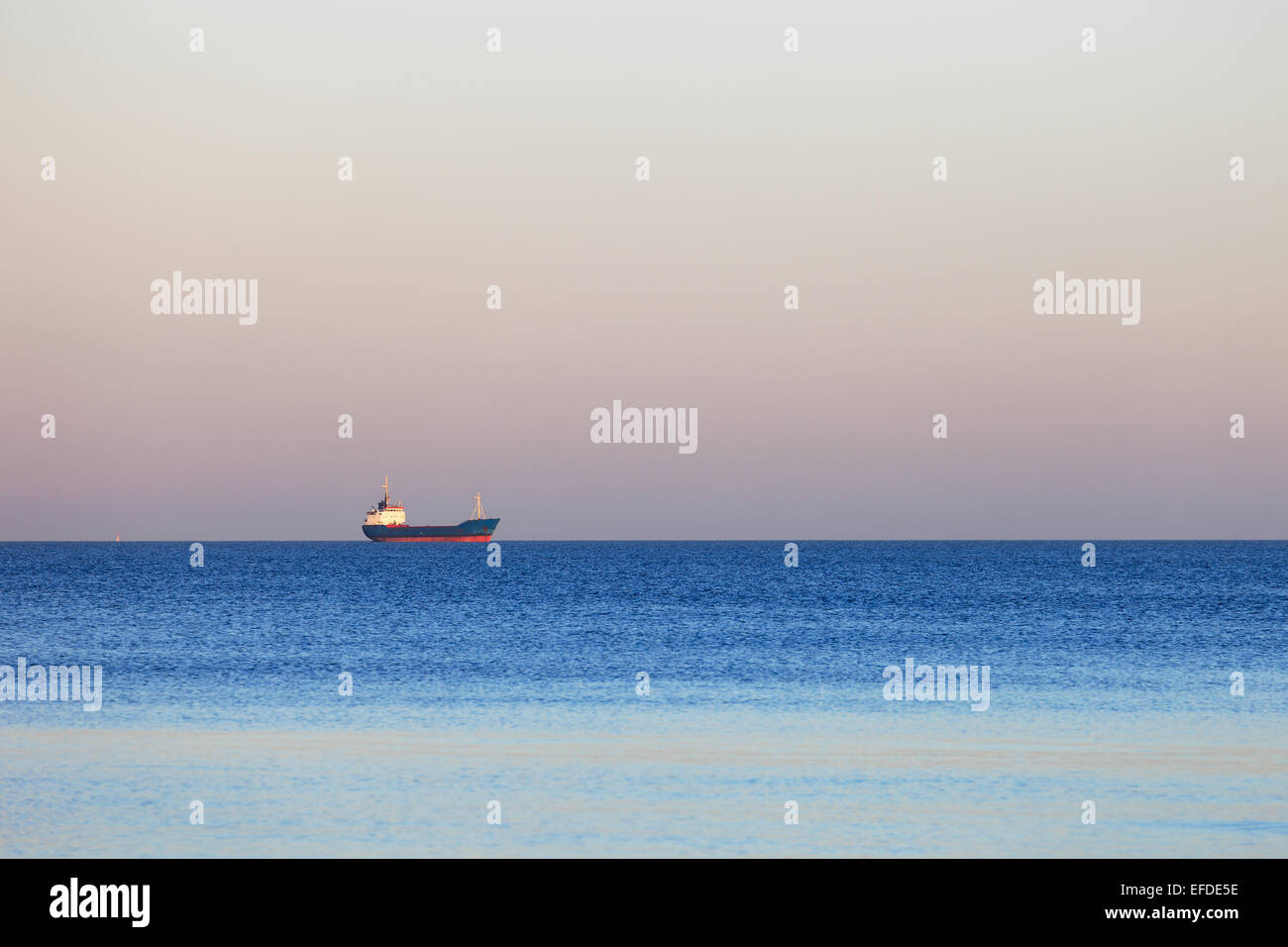 Lonely boat floating on calm hi-res stock photography and images - Alamy