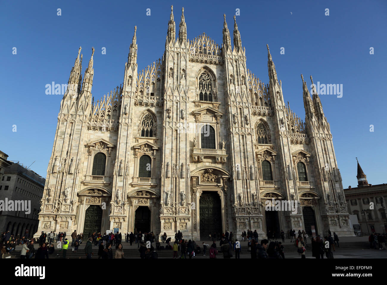 The facade of the cathedral (Duomo) in Milan, Italy. The Gothic style ...