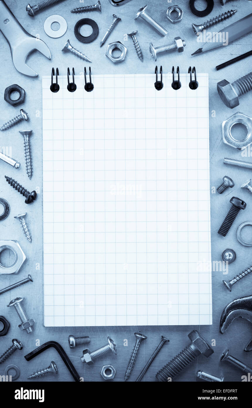 hardware tools and notebook at metal background texture Stock Photo - Alamy