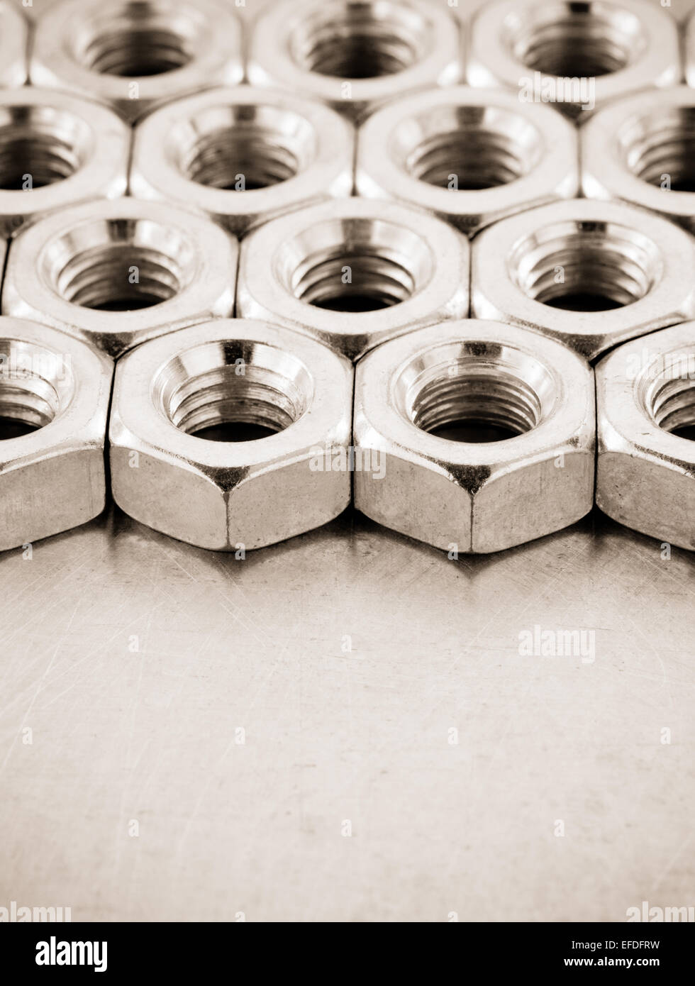 nuts tool at metal background texture Stock Photo - Alamy