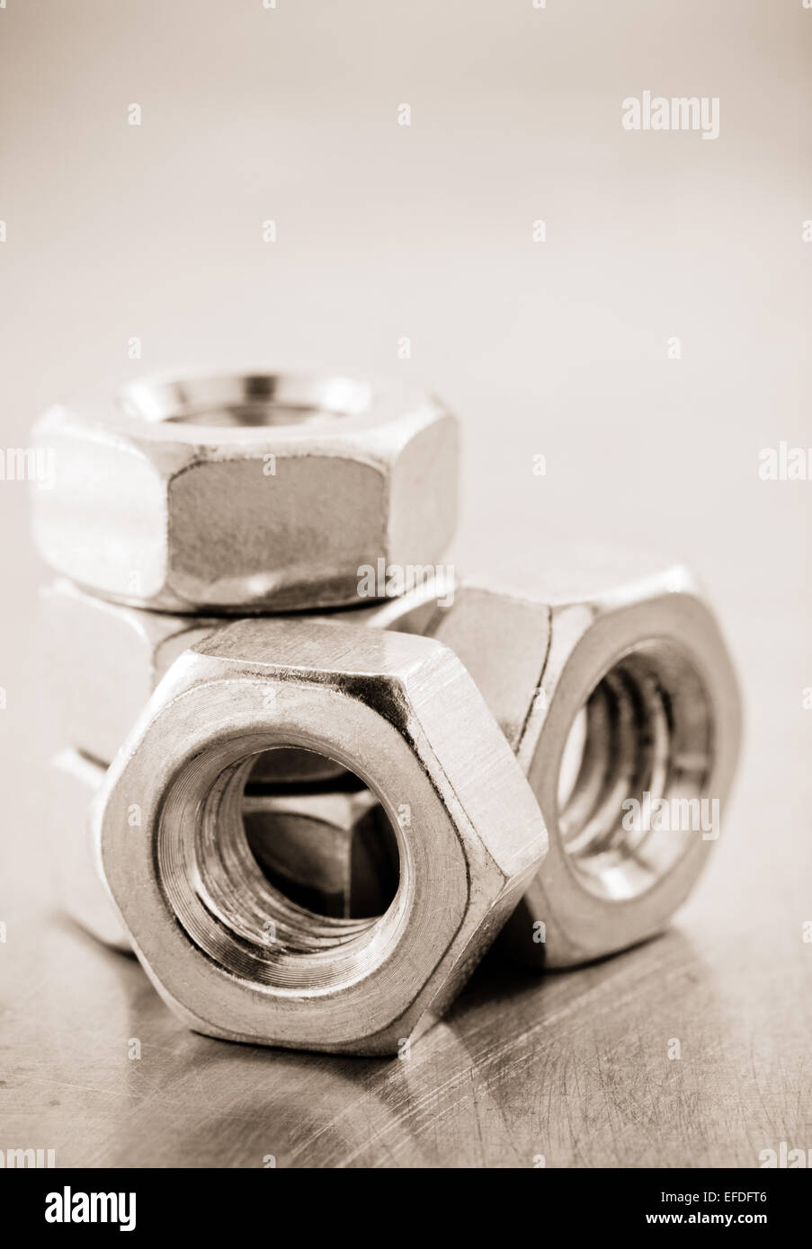 nuts tool at metal background texture Stock Photo - Alamy