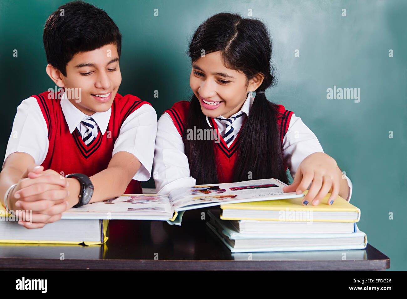 2 indian school friends book Study Stock Photo - Alamy