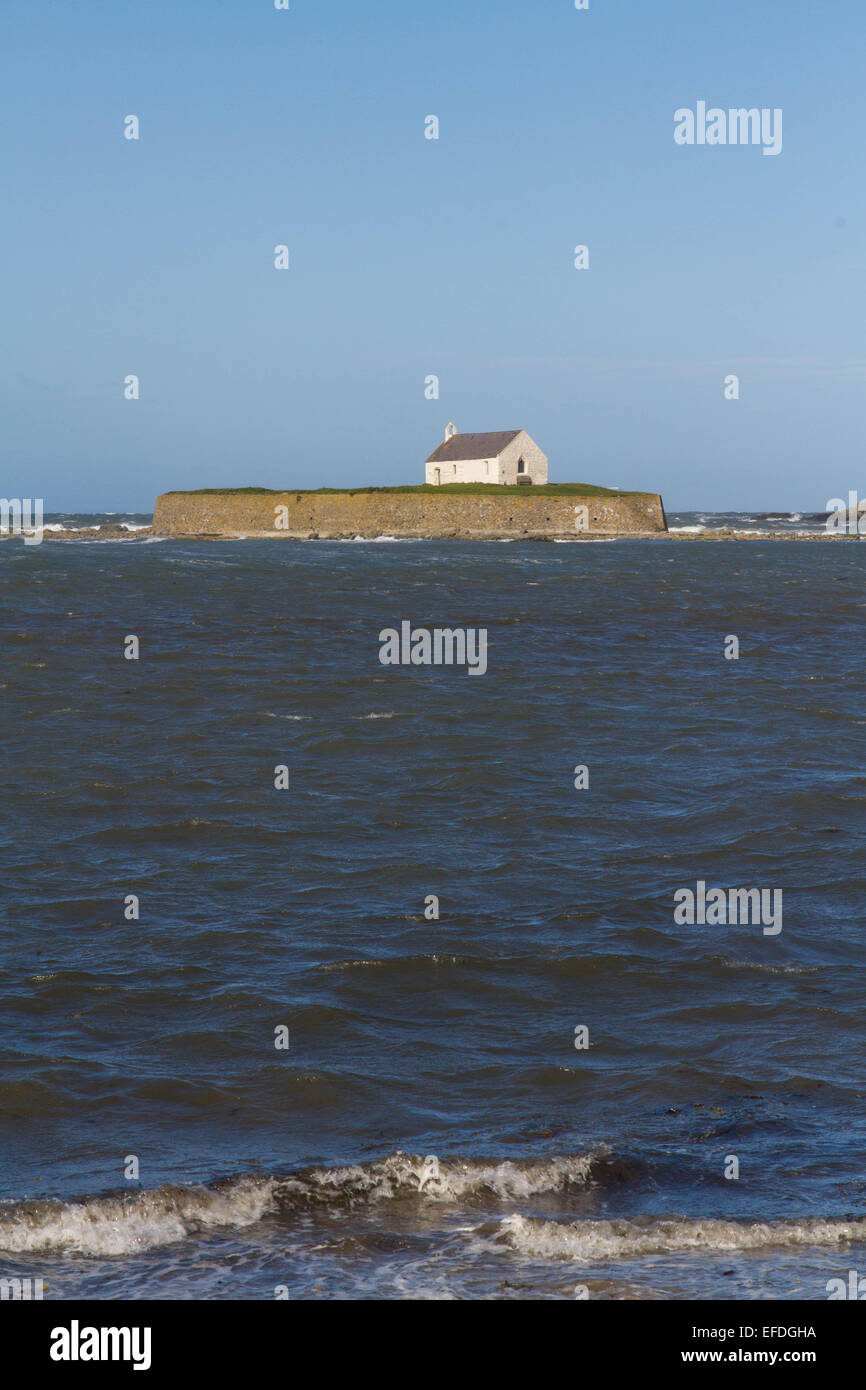 Looking out to see at high tide at St Cwyfan’s Church, the Church in ...