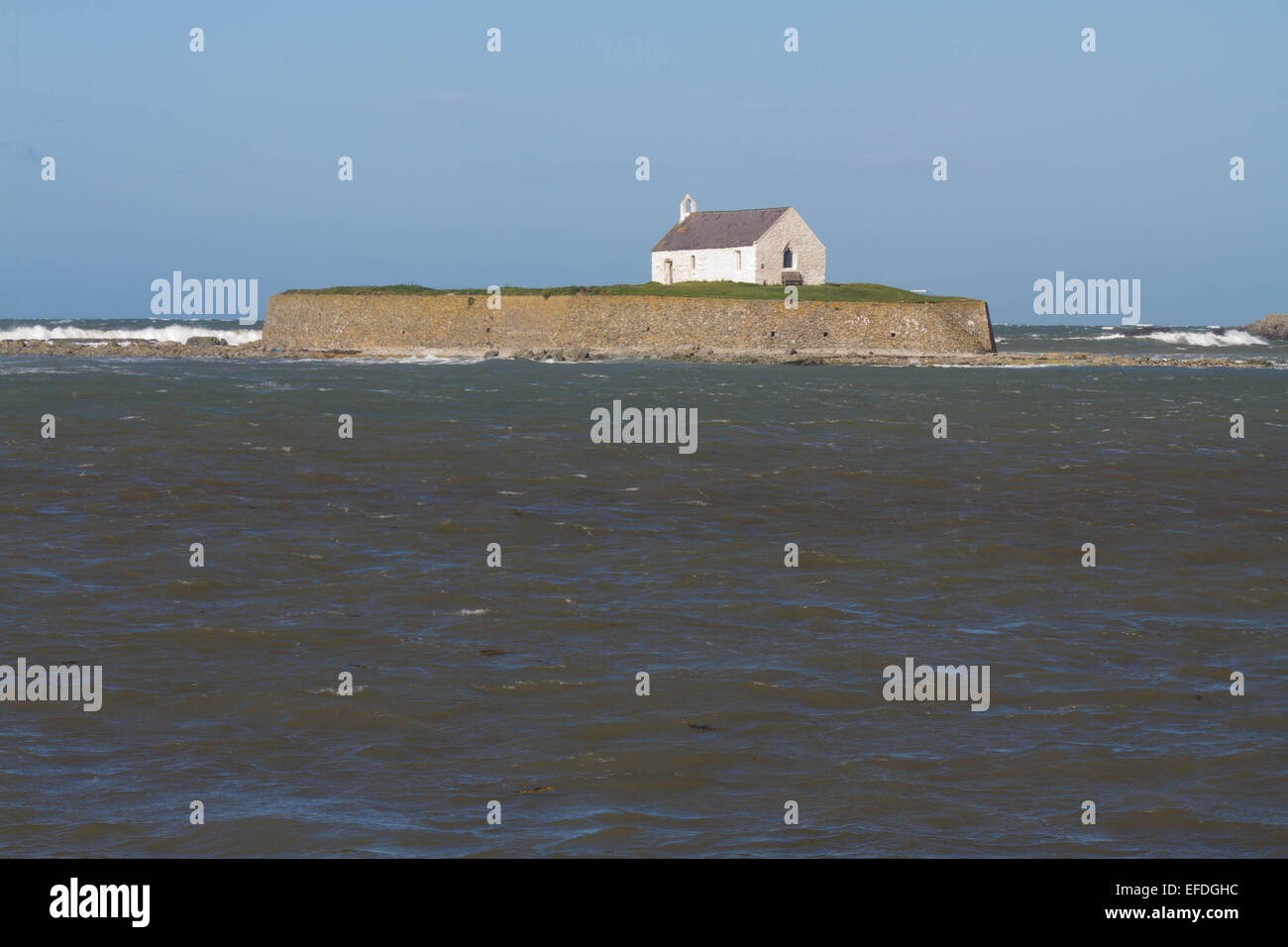Looking out to see at high tide at St Cwyfan’s Church, the Church in ...