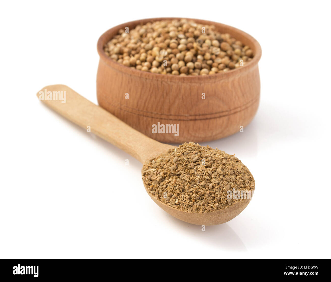 coriander spices in spoon isolated on white background Stock Photo - Alamy