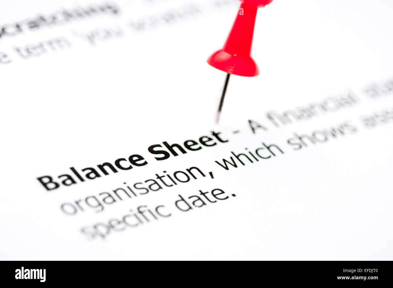 Word Balance Sheet pinned on white paper with red pushpin, copy space ...