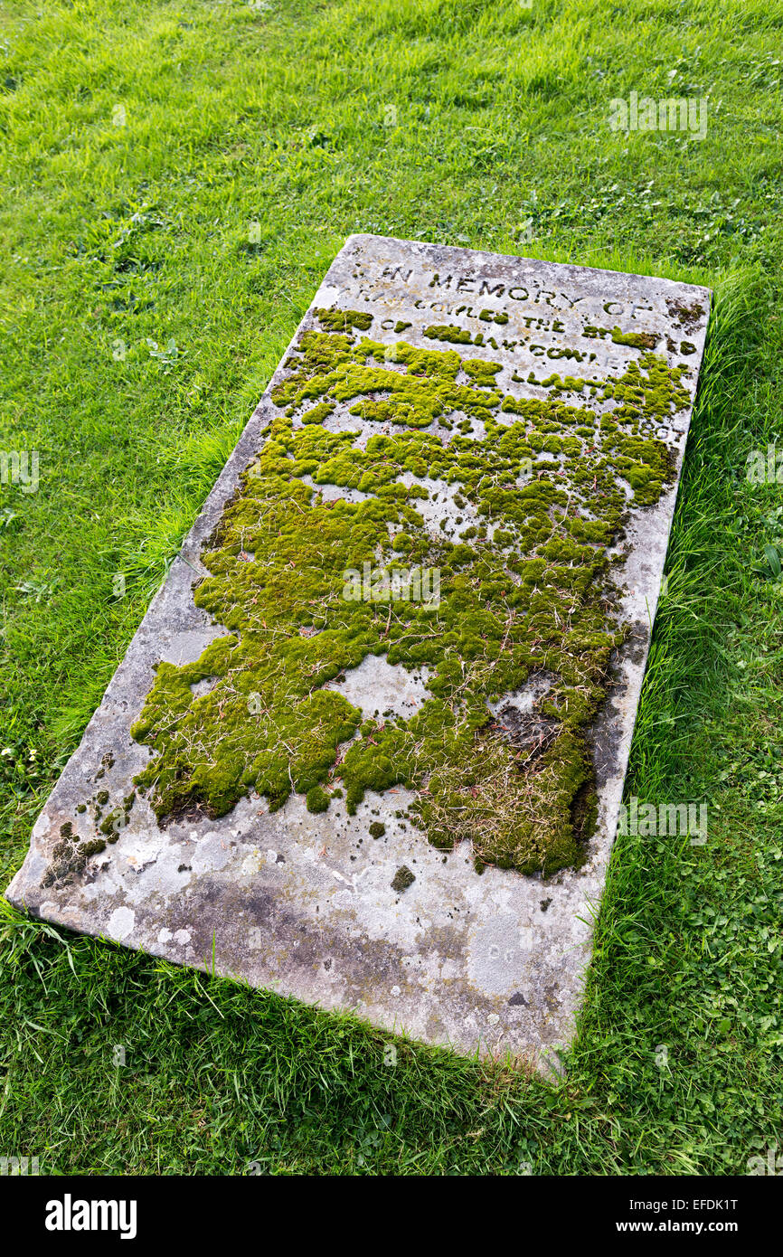 Gravestone covered in moss, St Bridget's Church, classic Norman form ...