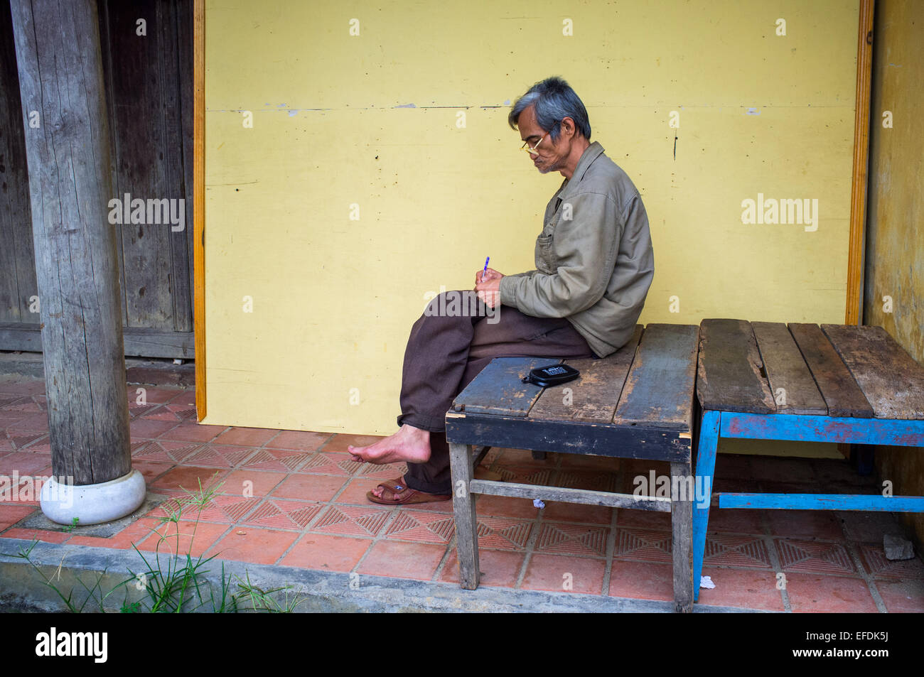 Man outside his house in Hoi An, Vietnam, Asia Stock Photo - Alamy