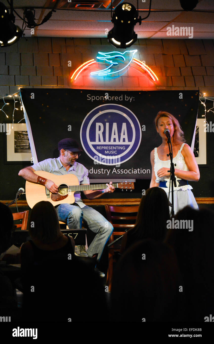 A songwriter gives it their all in a showcase performance with an ...