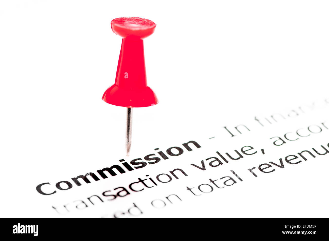 Word Commission pinned on white paper with red pushpin, copy space ...