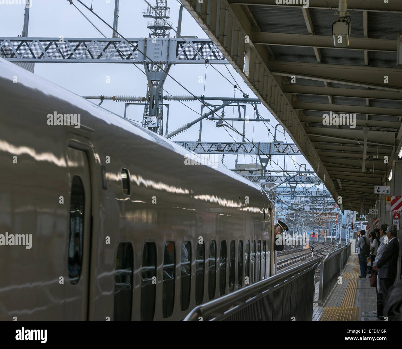 Shinkansen conductor leaving the platform of Shizuoka Station, Shizuoka ...