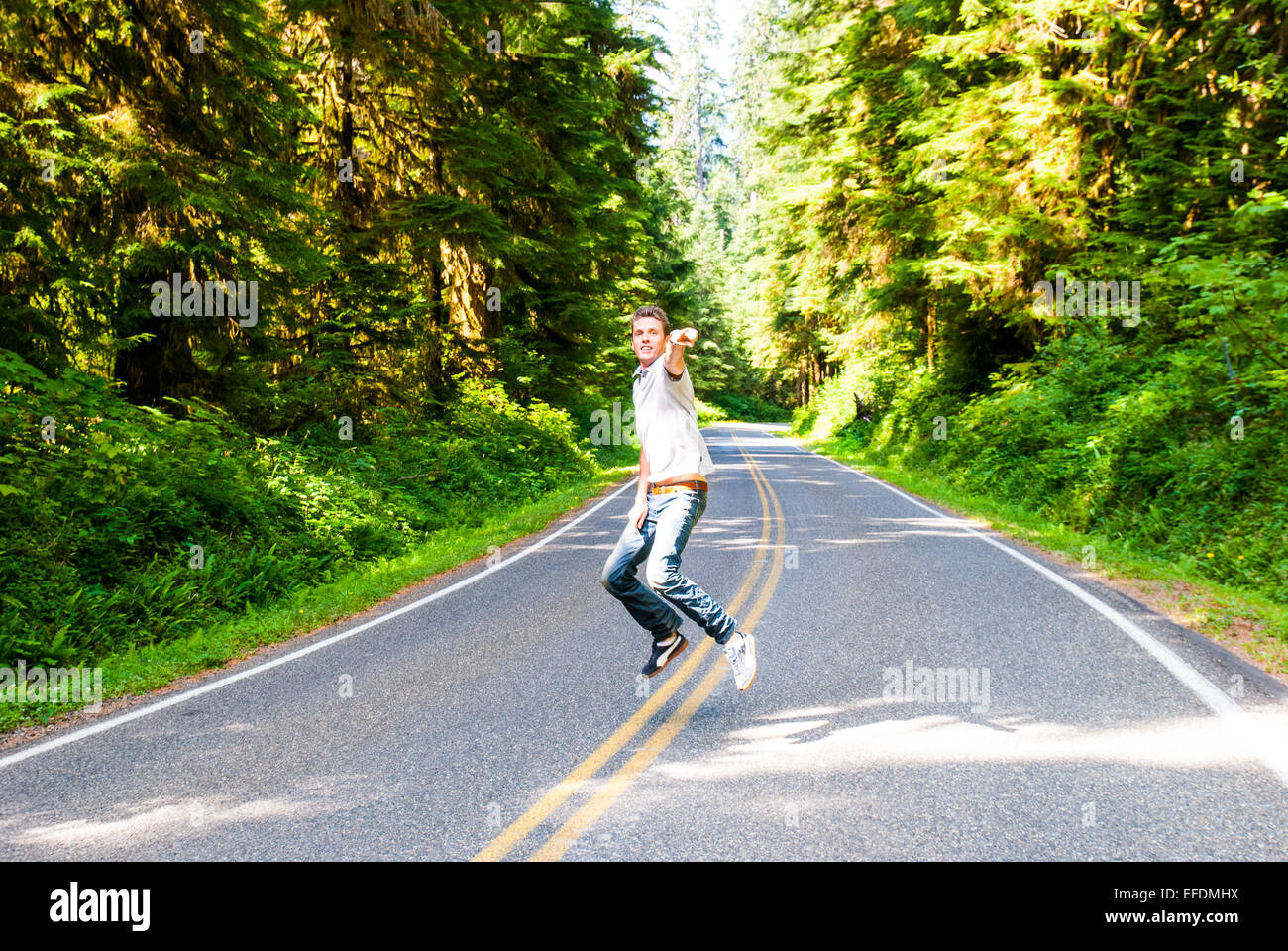 Happy guy jumping in the air Stock Photo - Alamy