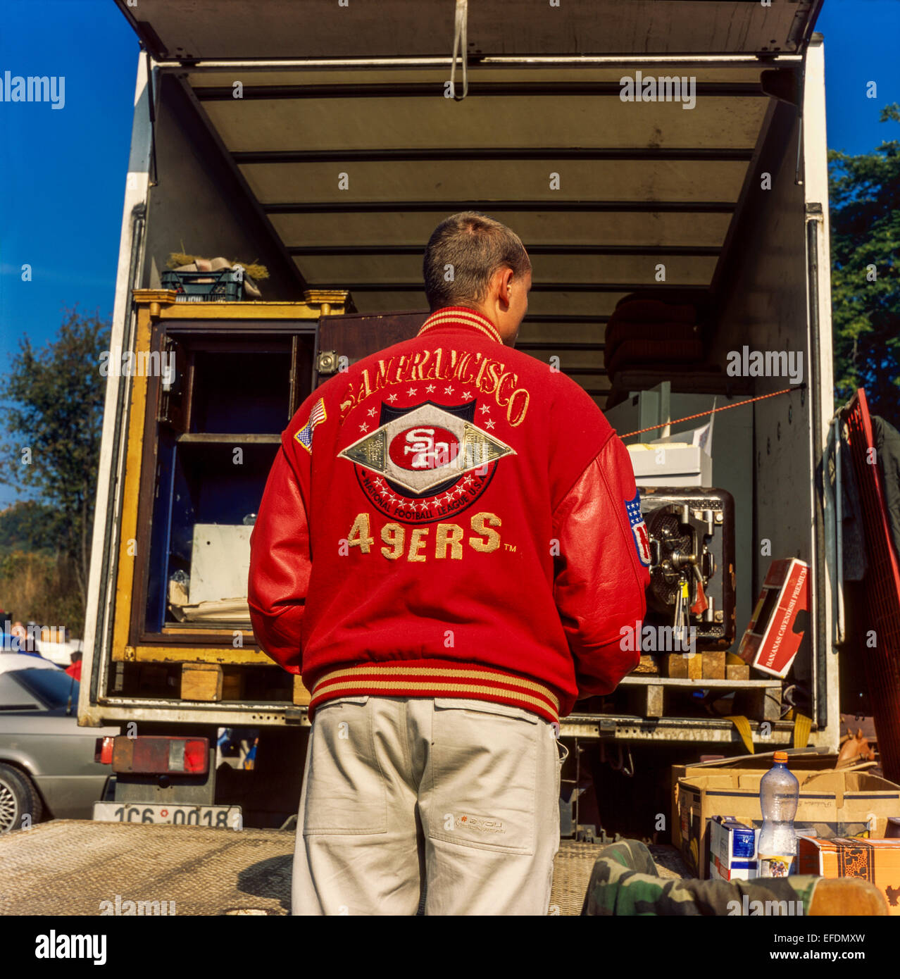 Person in red jacket hi-res stock photography and images - Alamy