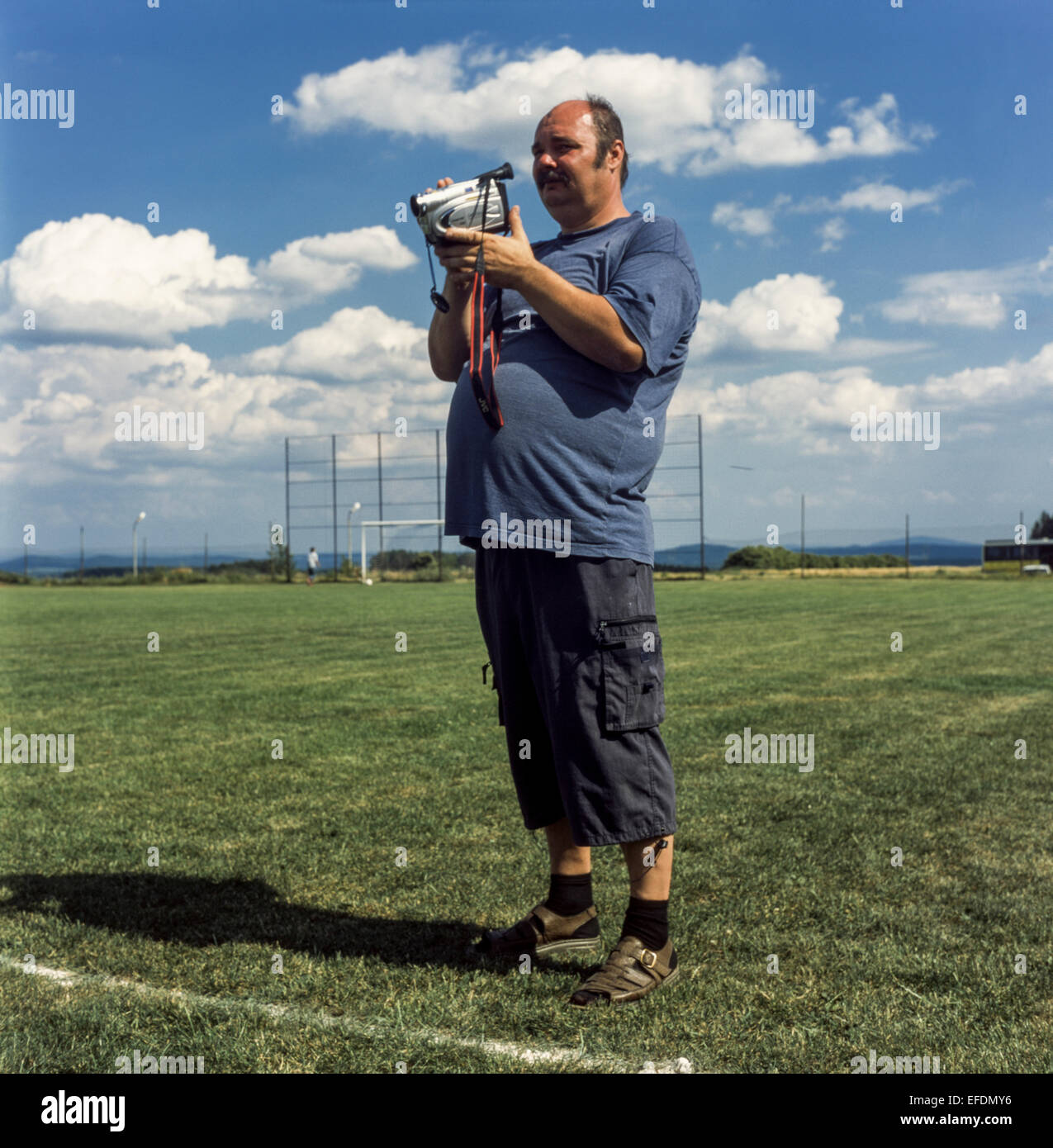 Senior man with a video camera, Czech Republic Europe man alone 1990s ...