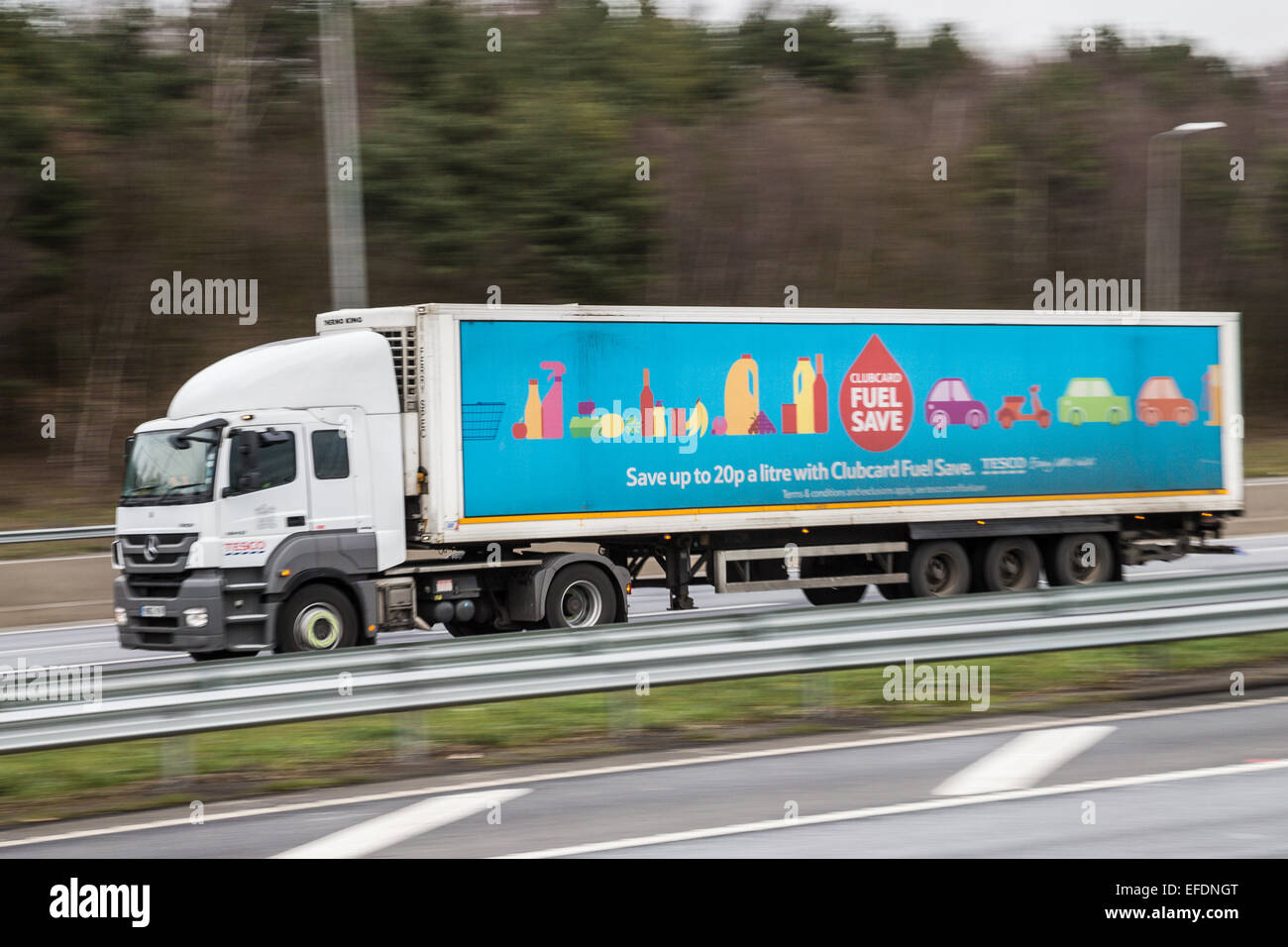 Tesco branded articulated lorry heading westbound on the M25 Motorway ...