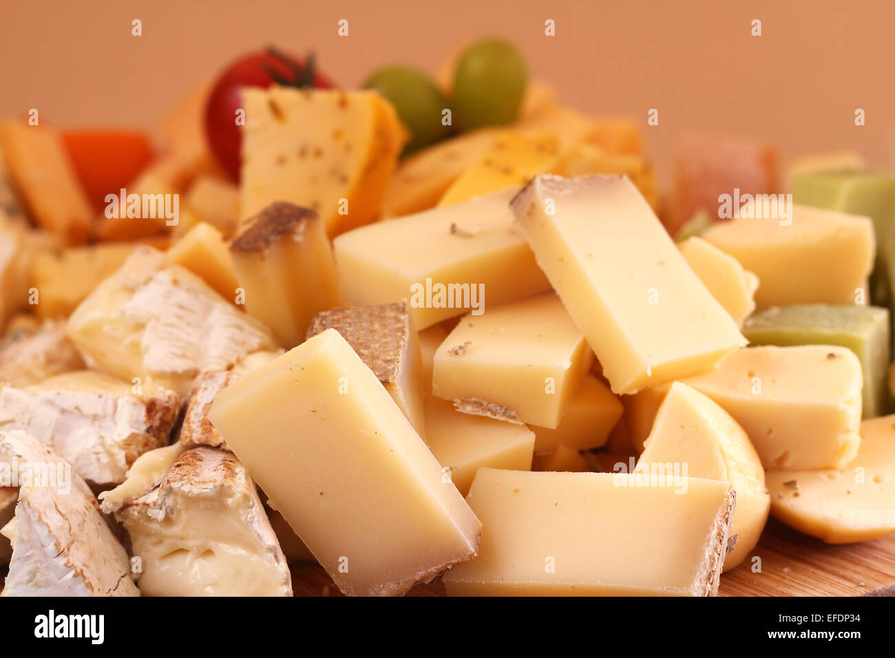 Cut french cheese blocks background close-up Stock Photo - Alamy