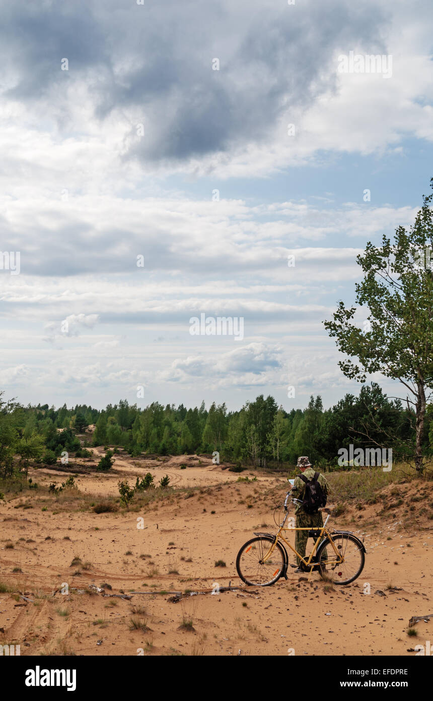 Sandy roads and dunes, the wood and trees on the route of a car racing ...
