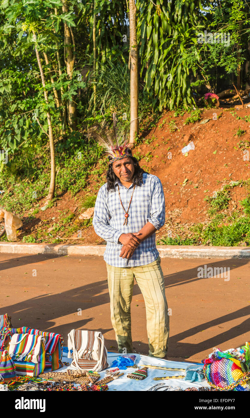 Argentinian street trader with feathered headband selling roadside ...