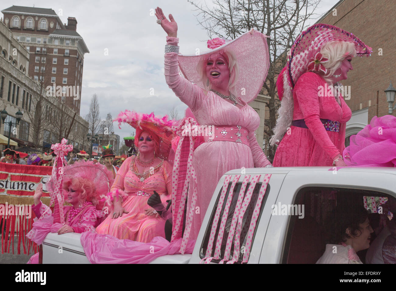 Frilly costumed ladies all in pink with pink skin, one with a beard ...