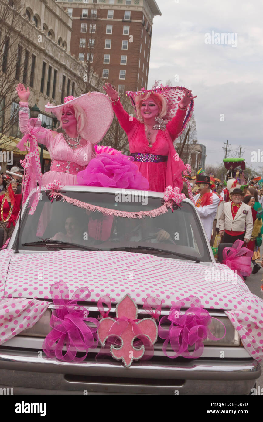 Frilly ladies dressed all in pink with pink skin, one with a beard ...