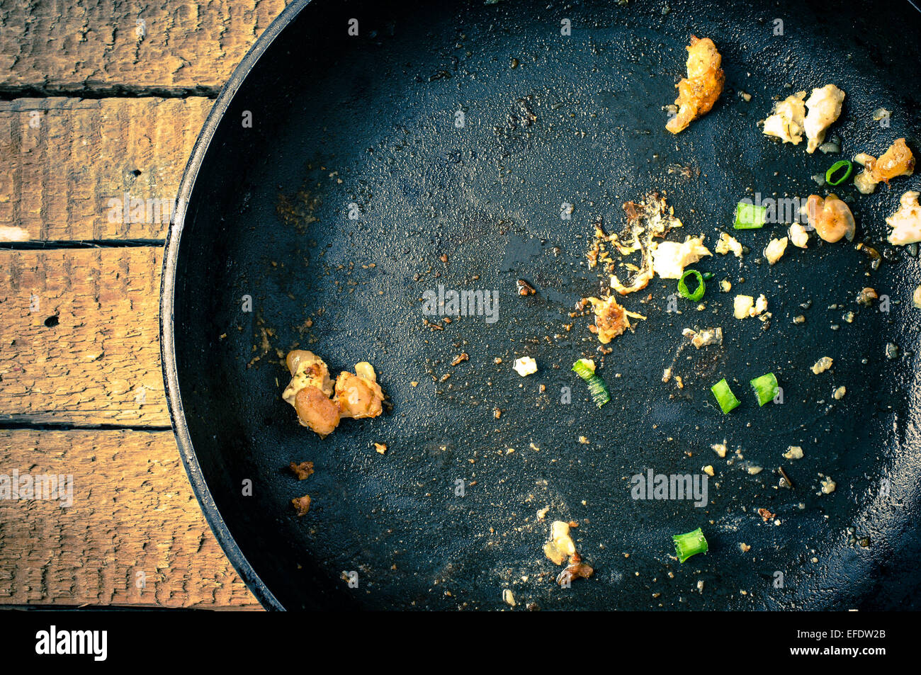 Empty pan with leftovers after dinner village Stock Photo - Alamy