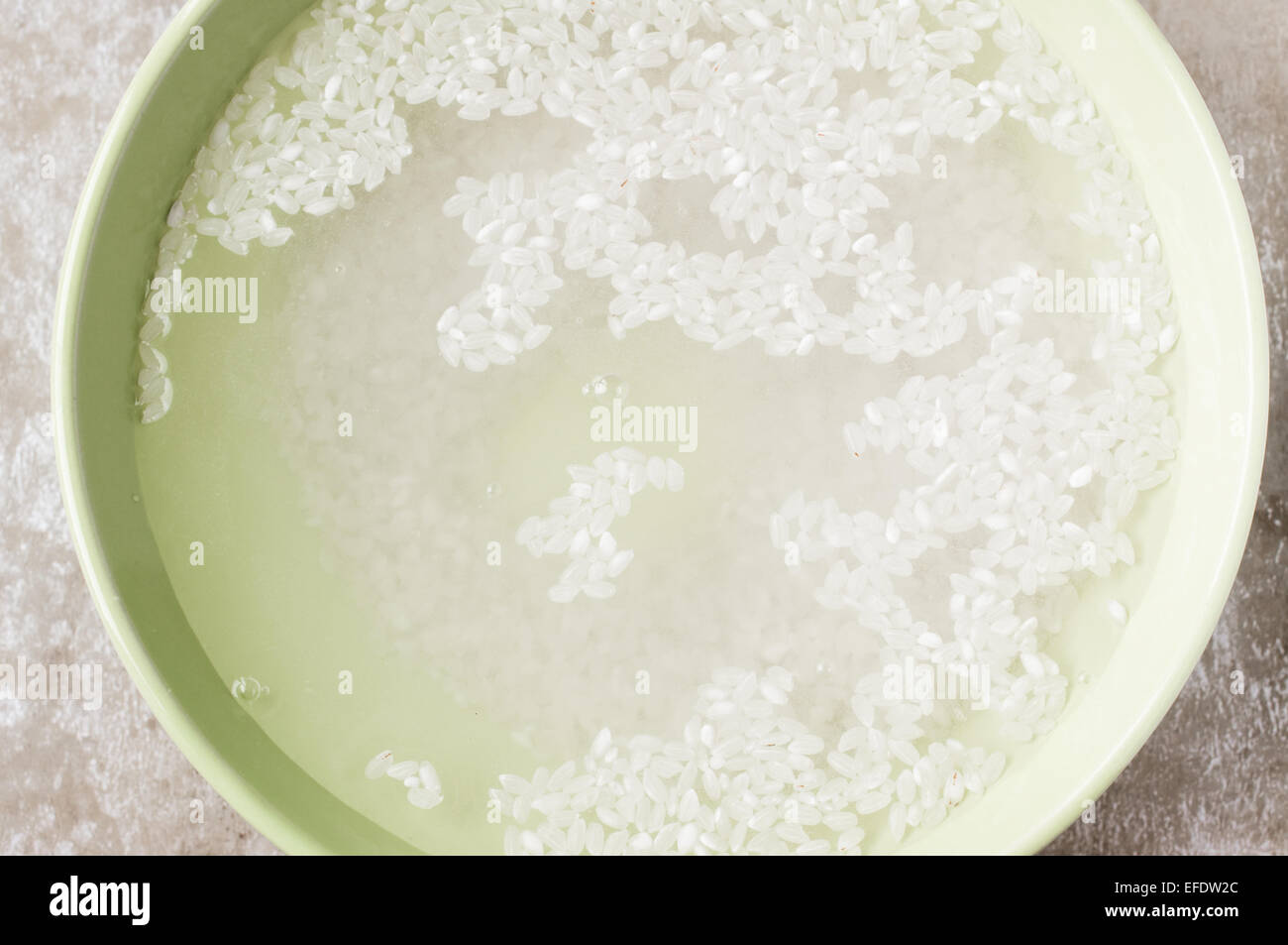 Washing with clean water in the rice bowl of green Stock Photo - Alamy