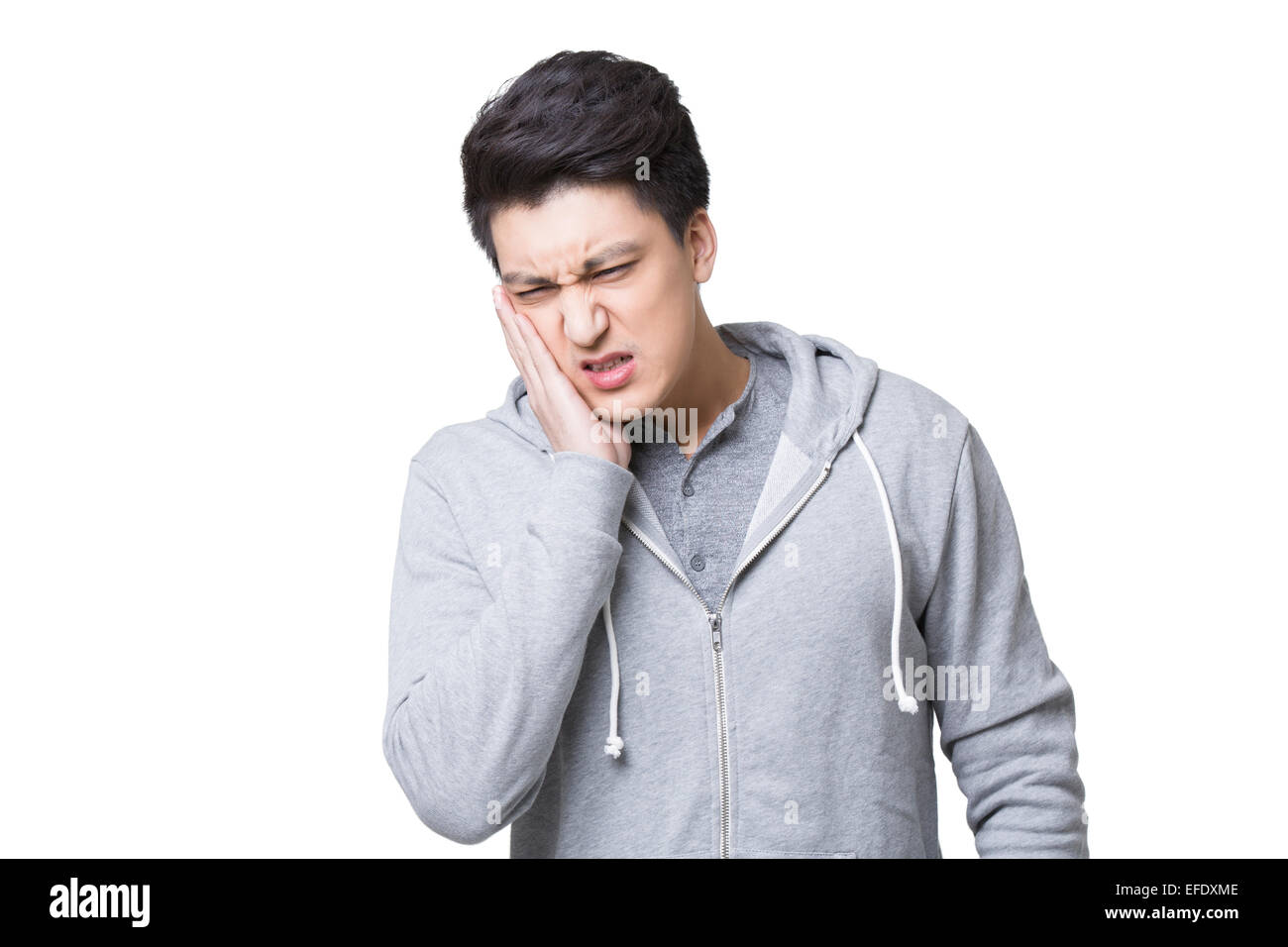 Young man with toothache Stock Photo - Alamy