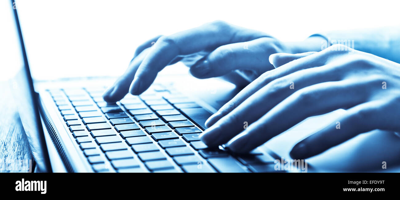 Human hands working on laptop Stock Photo - Alamy