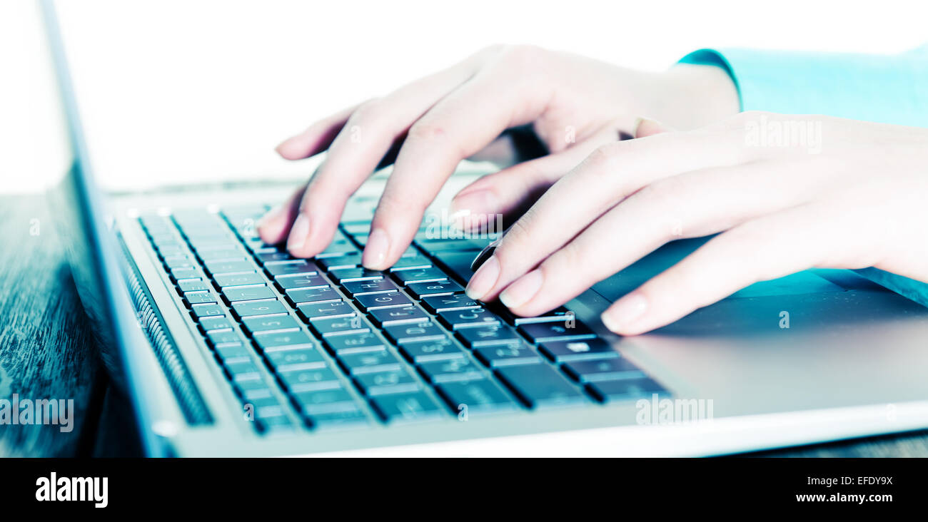 Human hands working on laptop Stock Photo - Alamy