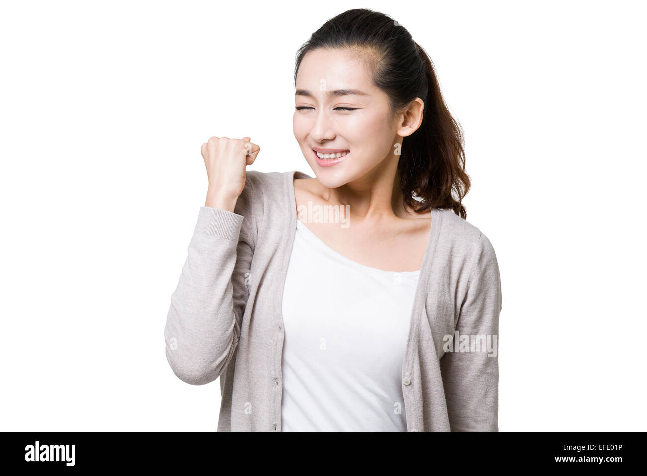 Young woman cheering Stock Photo - Alamy