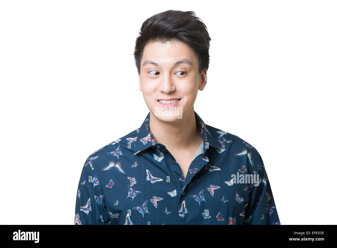 Young man with sideways glance Stock Photo - Alamy