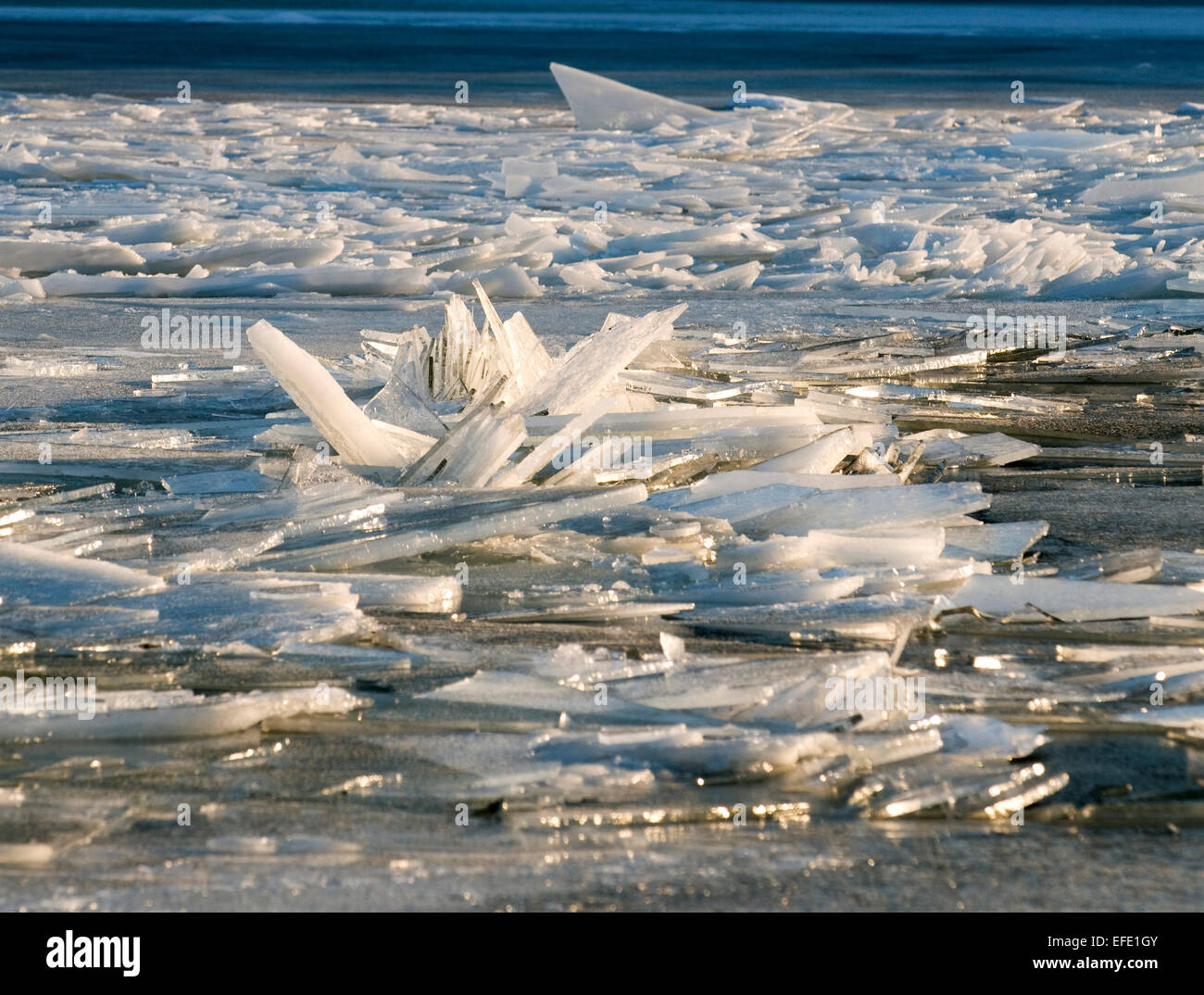 Winter: ice has covered the river. There is a pile-up of ice cakes in ...