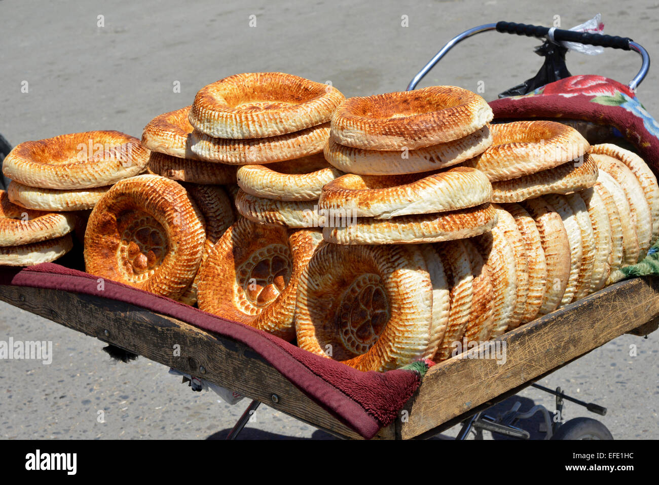 There are many lavashes on the trolley. The bread is held for sale ...