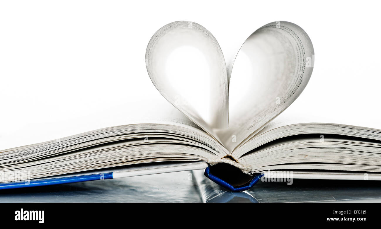 Book with opened pages and shape of heart Stock Photo - Alamy