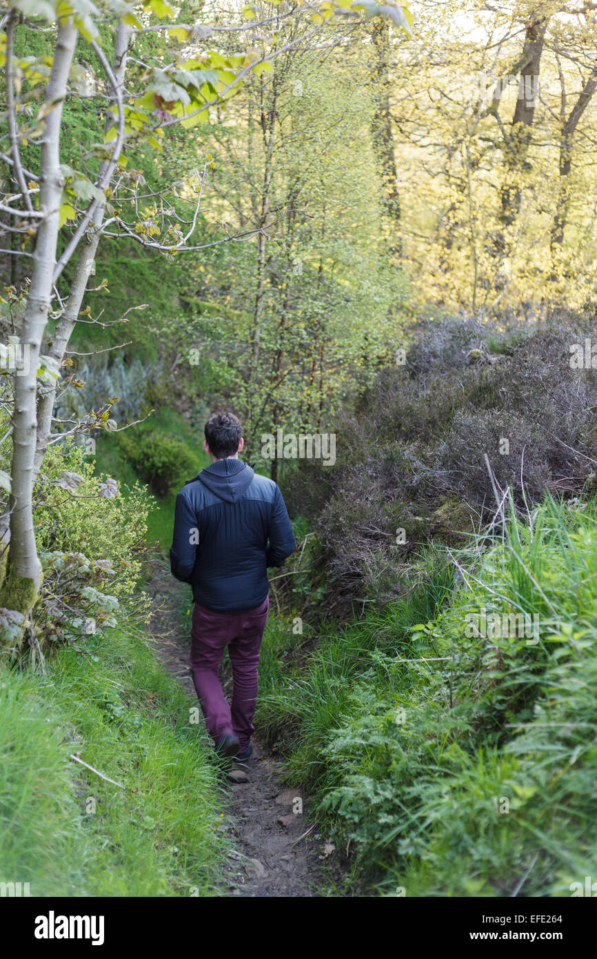 well dressed young man walking on a country path Stock Photo - Alamy