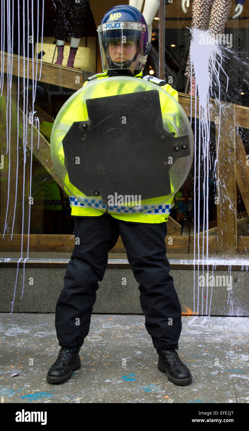 Female police officer in riot gear at Oxford Street branch of Top Shop ...