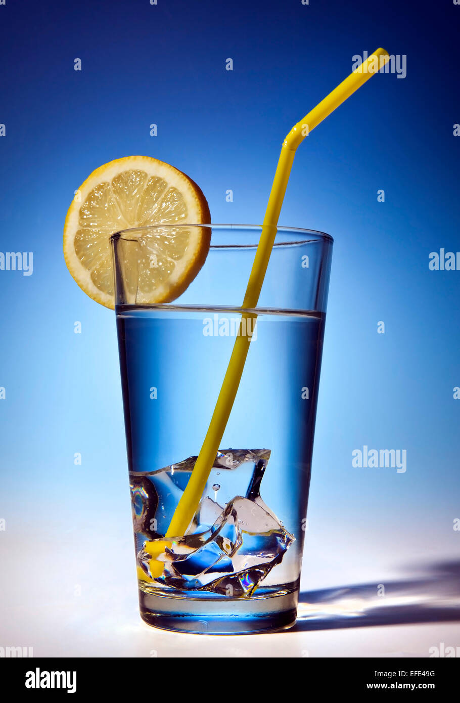 Water glass with ice cubes and lemon slice Stock Photo - Alamy