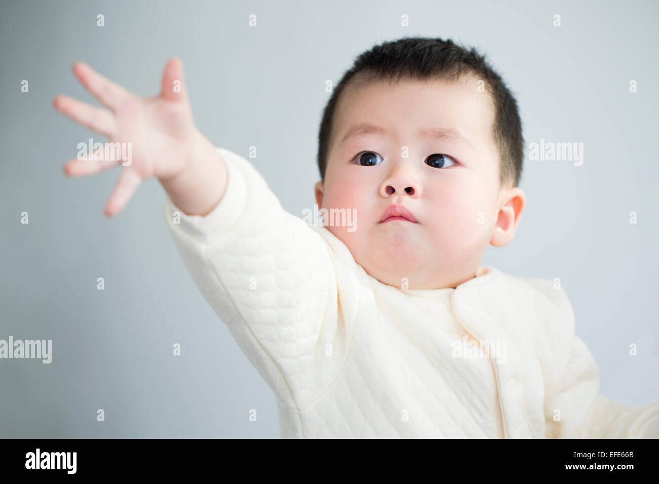 Baby and reaching arms hi-res stock photography and images - Alamy