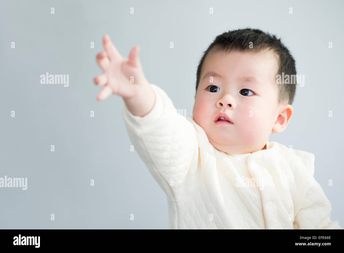 Baby reaching up hi-res stock photography and images - Alamy