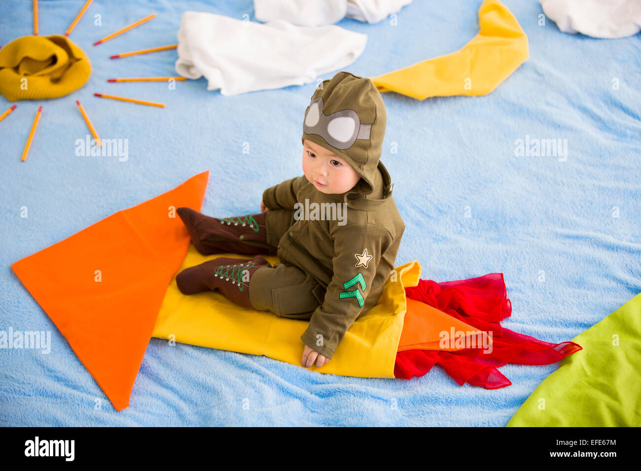 Cute baby sitting on rocket Stock Photo - Alamy