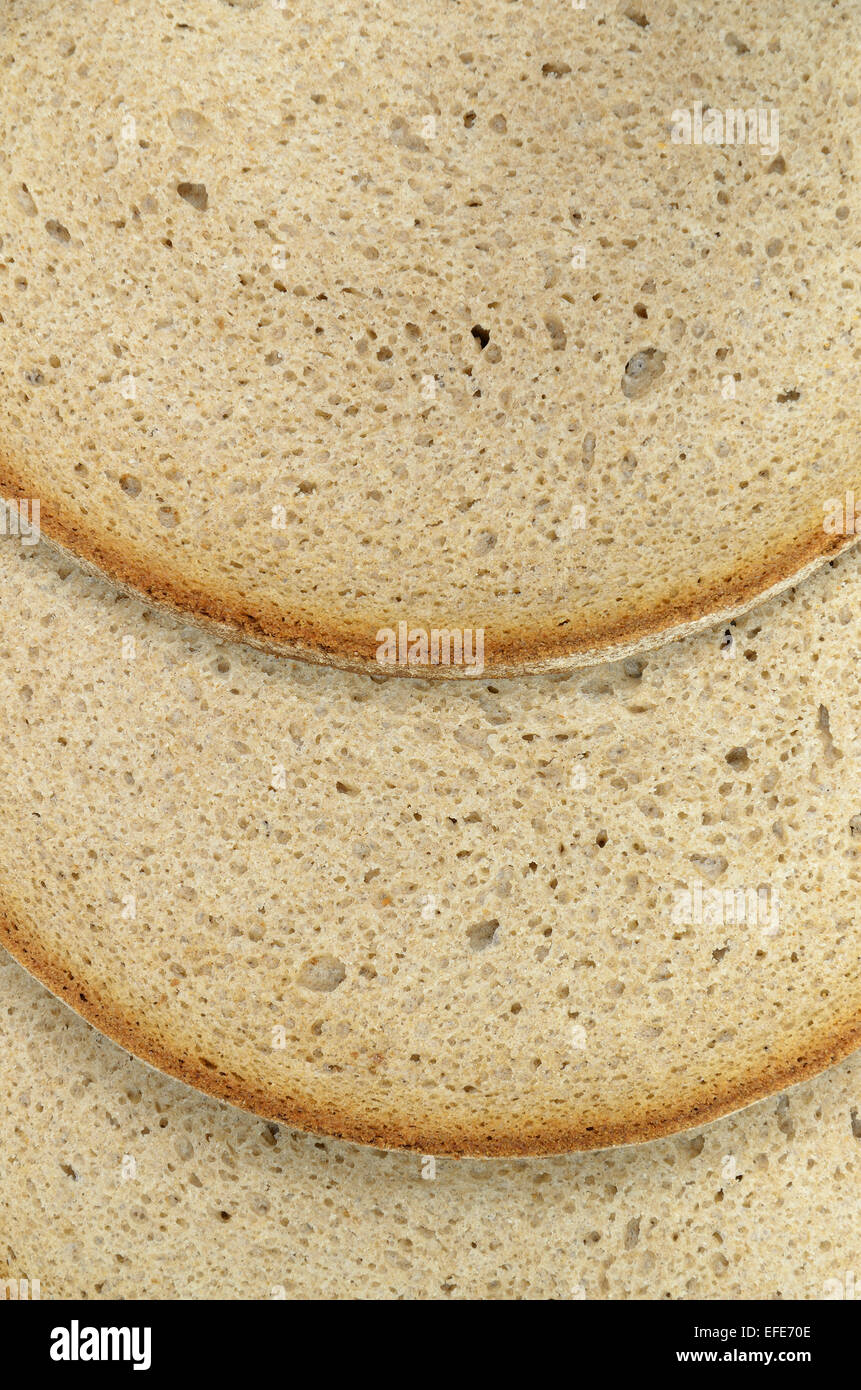 close up of three slices of brown bread, full frame, vertical Stock ...