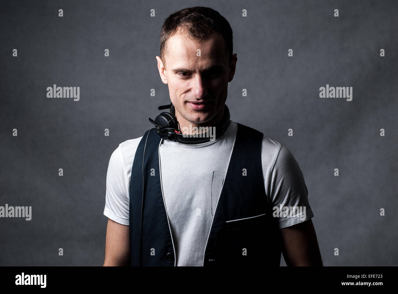 dj with headphones on white background Stock Photo - Alamy
