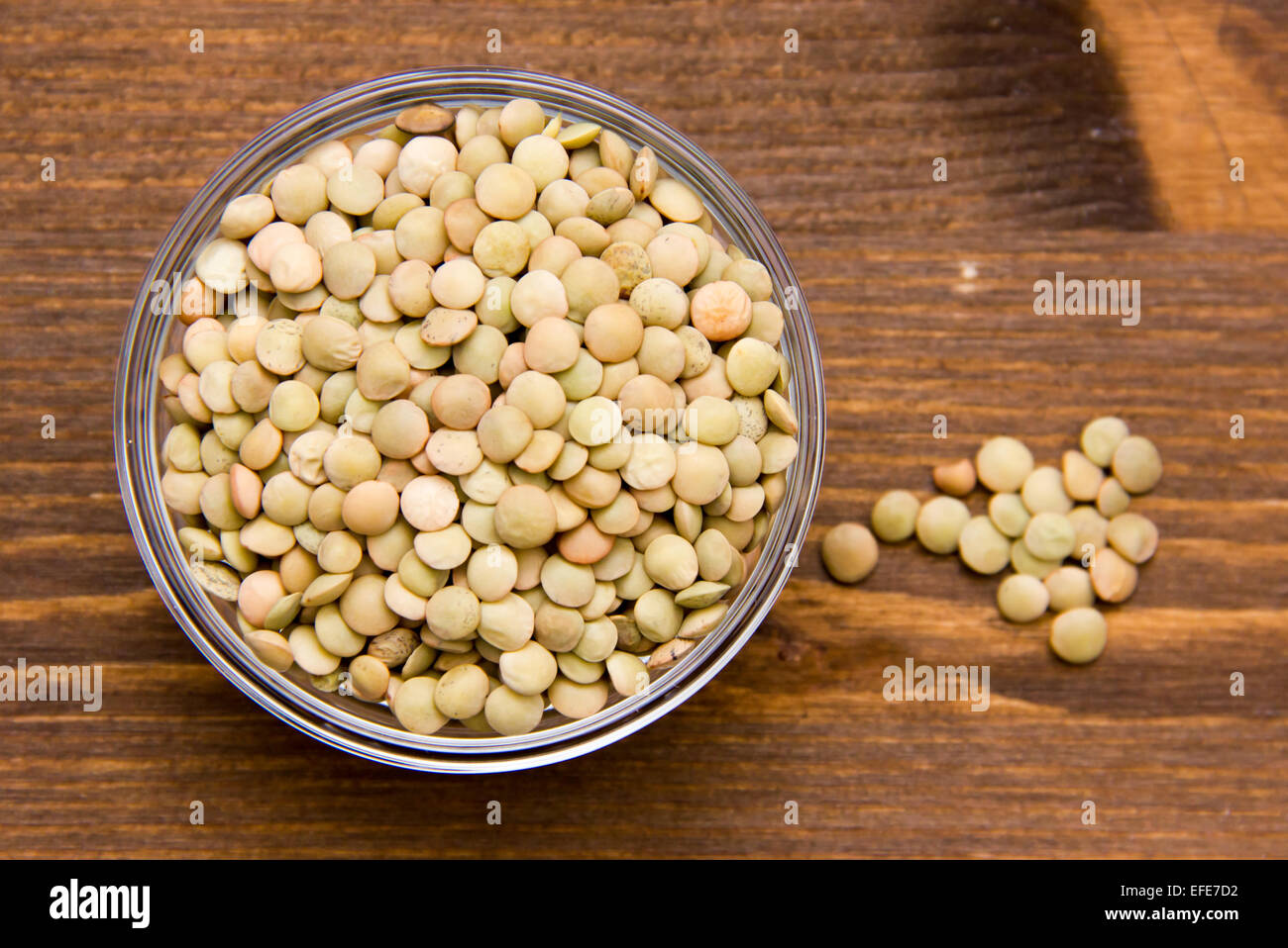 Lentils in wooden bowl over top views Stock Photo - Alamy