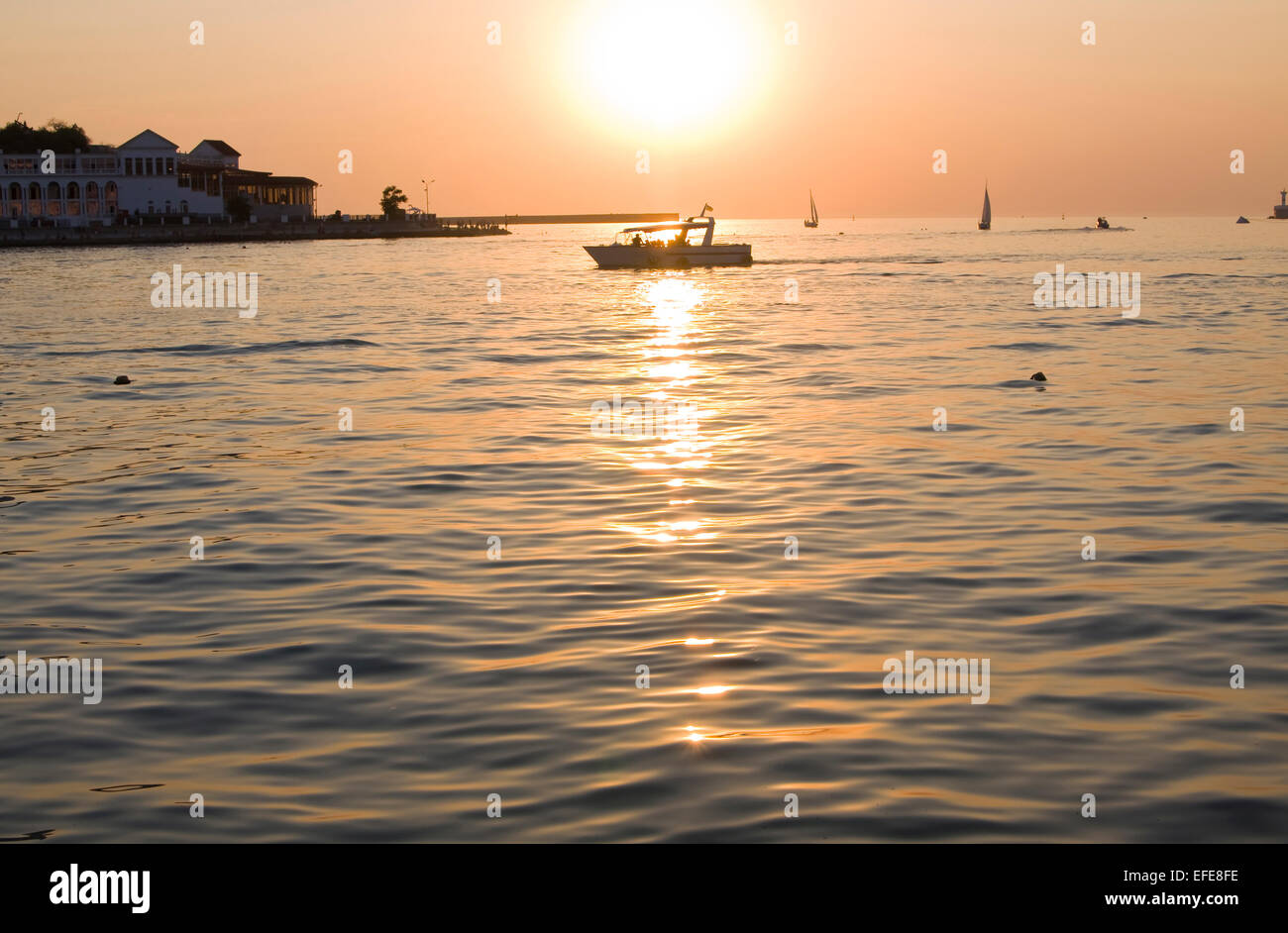 Sea landscape - sunset and ship on water Stock Photo - Alamy