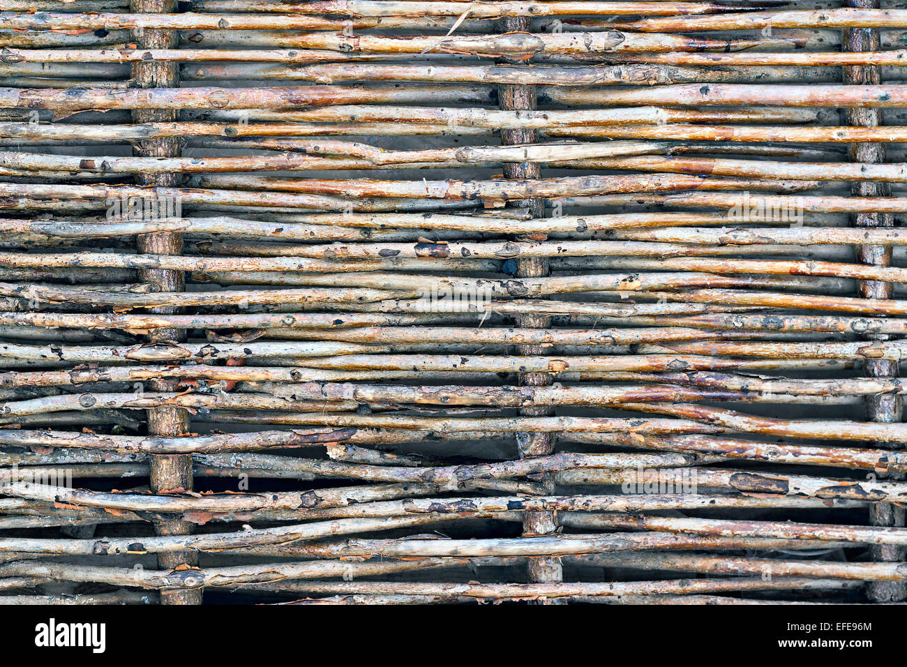 wattle fence of dry twigs in the background Stock Photo - Alamy